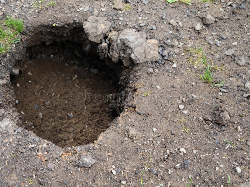 Hole in the ground stock photo. Image of earth, holes - 295003792