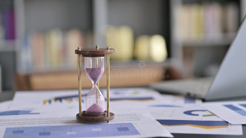 Close Up of Hourglass on Office Desk with Document Stock Image - Image ...
