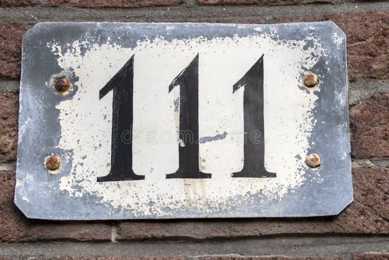 Close Up House Number 111 stock image. Image of brick - 203379427