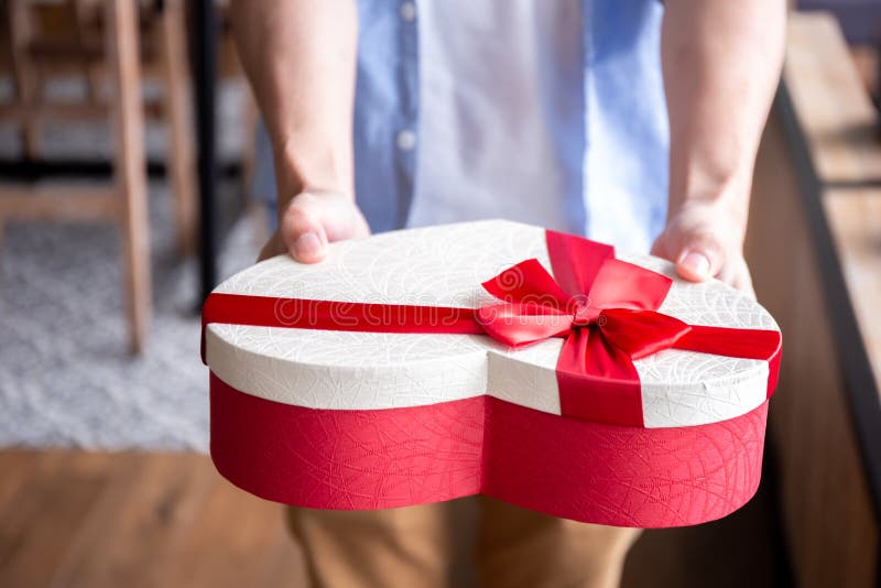 Close Up of Human Hands Receiving a Decorative Present Gift with Stock ...