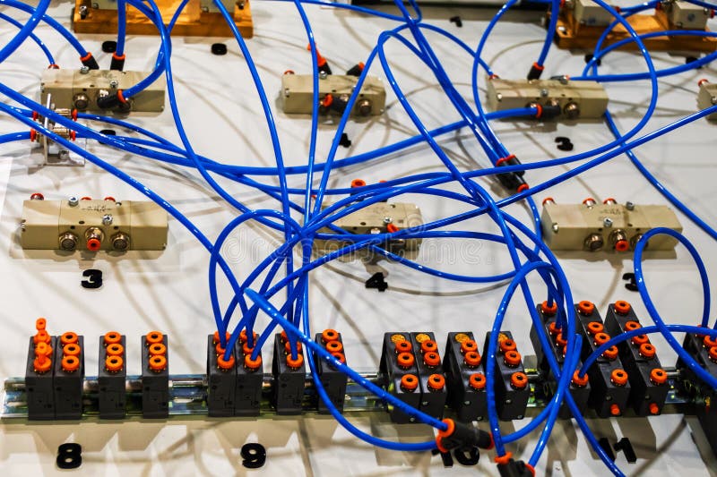 A Close-up of a Hydraulic Training Rig with Numerous Blue Hoses and ...