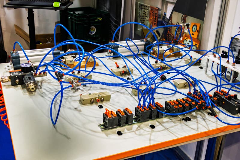 A Close-up of a Hydraulic Training Rig with Numerous Blue Hoses and ...