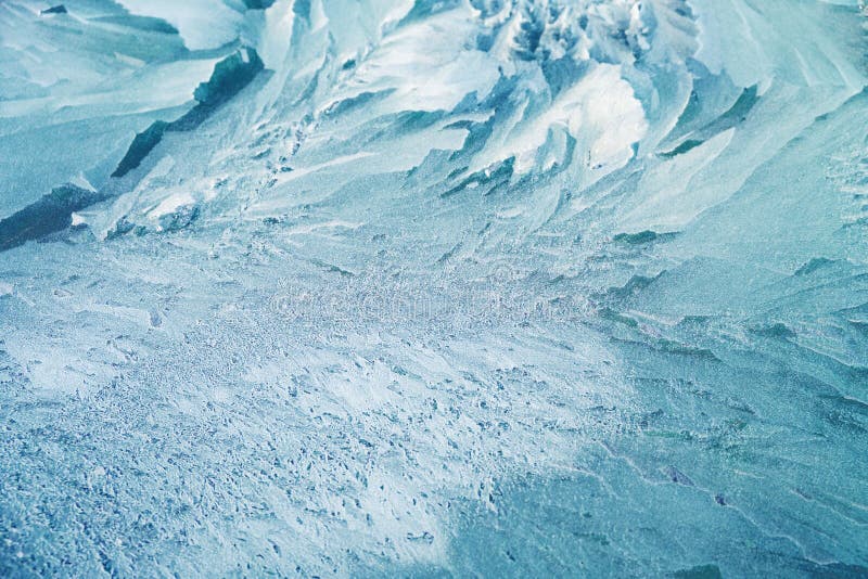 A Close-up of Ice Texture Partially Covered with Snow. the Surface ...
