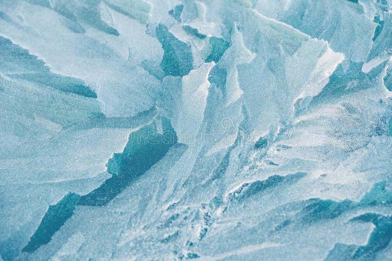 A Close-up of Ice Texture Partially Covered with Snow. the Surface ...