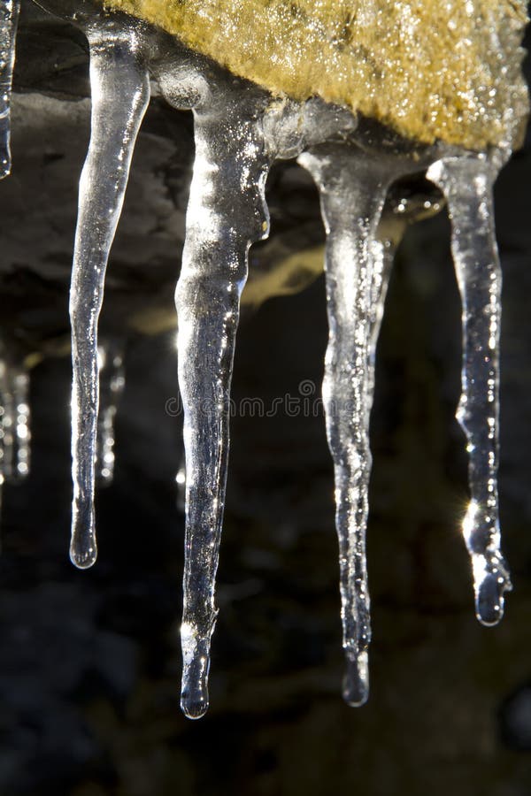 Close Up of Icicles Hanging from a Cliff Stock Image - Image of flare ...