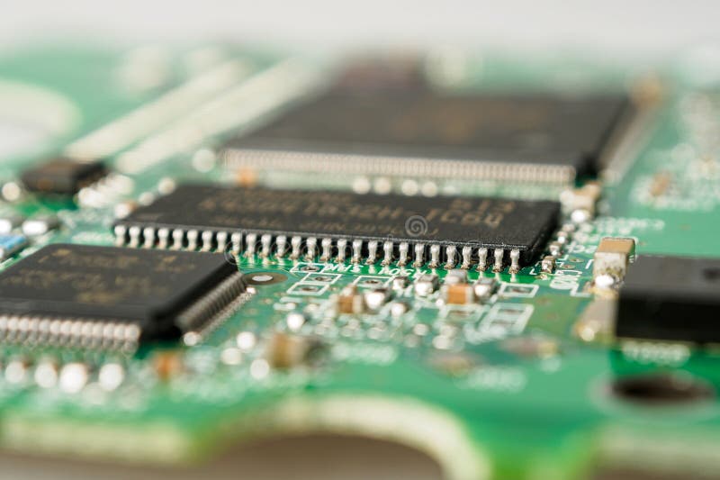 Close-up of ICs, Chips, Diodes and Capacitors on a Printed Circuit ...