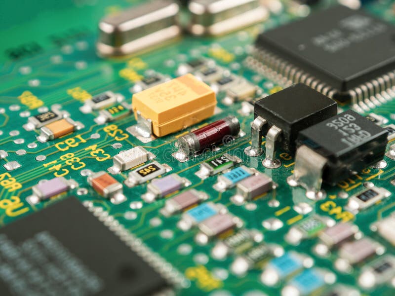 Close-up of ICs, Chips, Diodes and Capacitors on a Printed Circuit ...