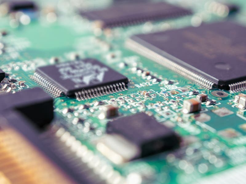 Close-up of ICs, Chips, Diodes and Capacitors on a Printed Circuit ...