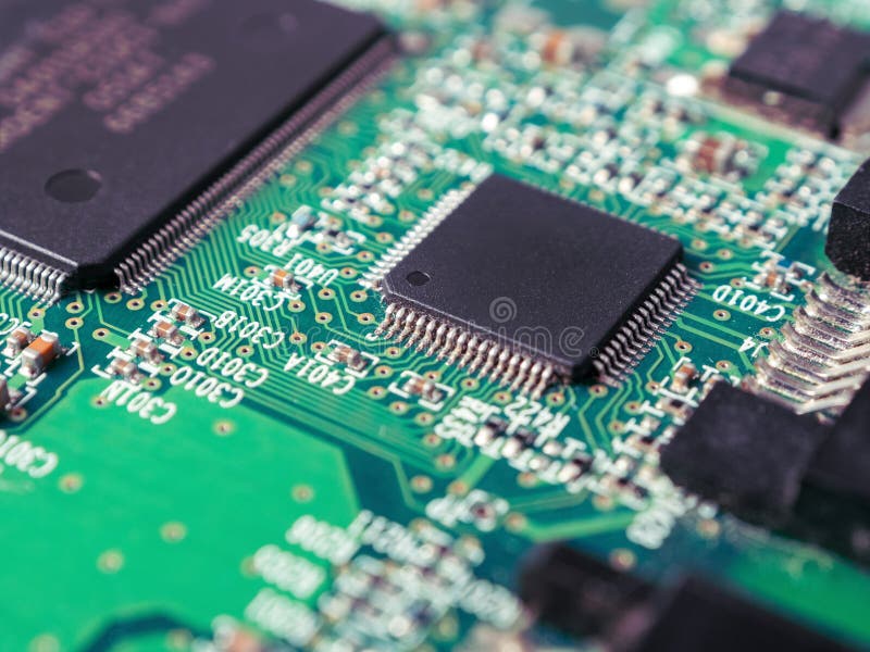 Close-up of ICs, Chips, Diodes and Capacitors on a Printed Circuit ...