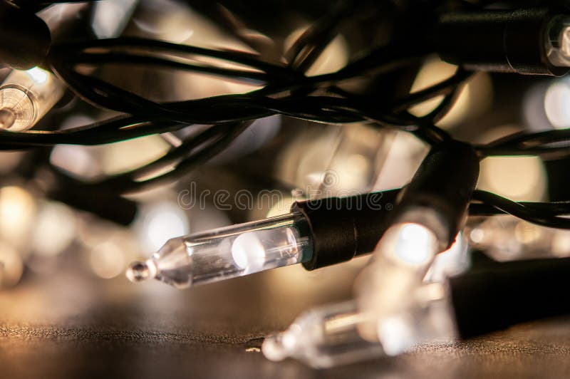 Close-Up of Illuminated String Lights Tangled in a Cluster Against a ...