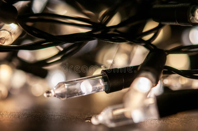 Close-Up of Illuminated String Lights Tangled in a Cluster Against a ...