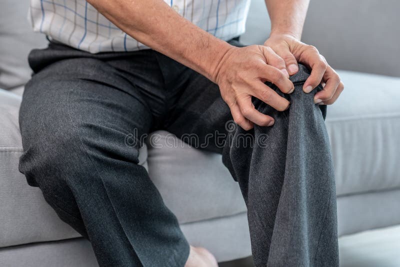 Close Up Image of an Agonizing Senior Man with Knee Problem. Stock ...