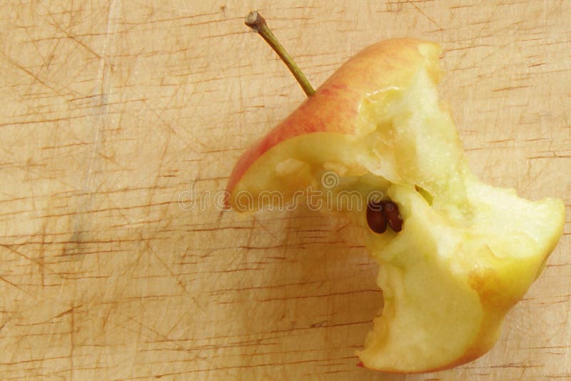 Close Up Bitten Apple Core on a Wooden Board Stock Image - Image of ...