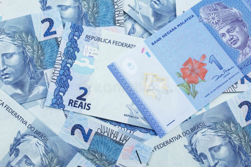 A Malaysian Ringgit on a Background of Brazilian Two Reais Bank Notes ...