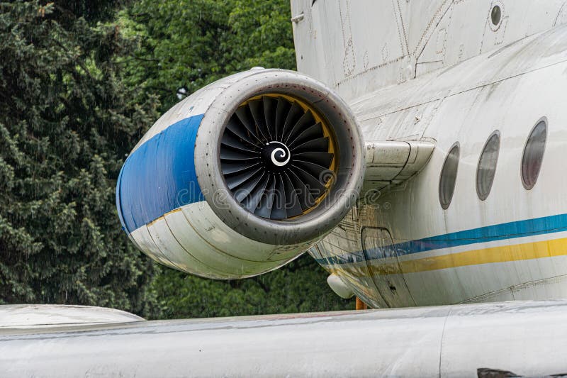 Close-up Image of a Blue and Yellow Passenger Jet Engine in Motion ...