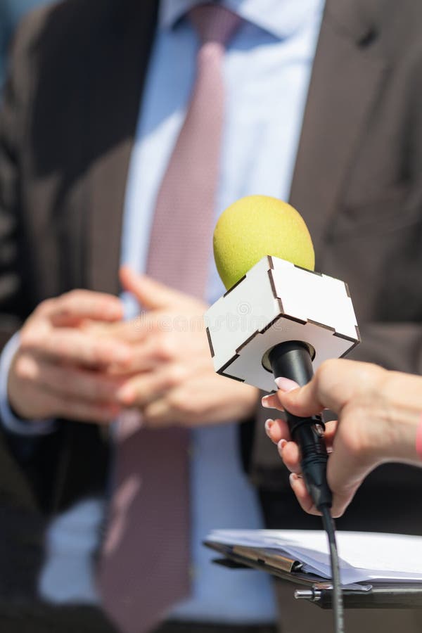 Close-up Image Captures a Journalist S Microphone at a Press Conference ...