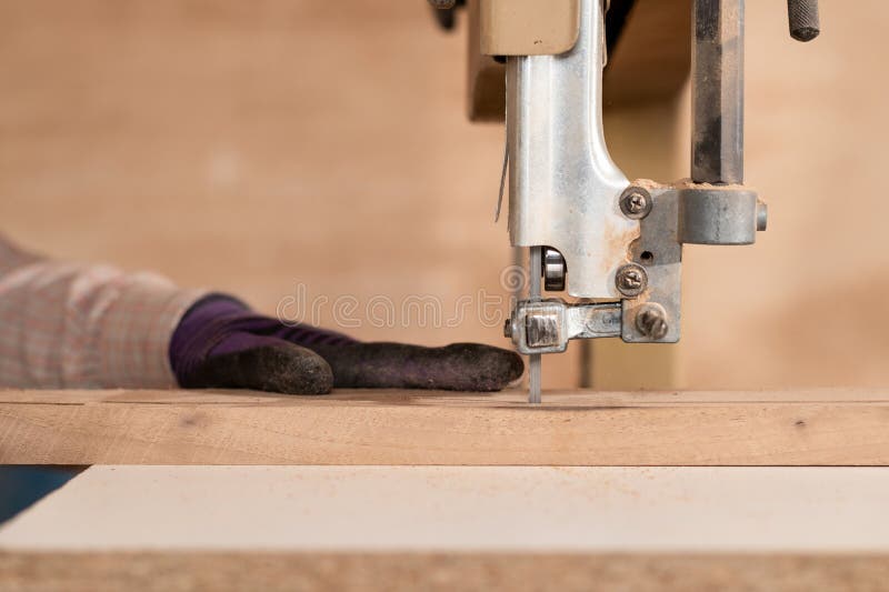 Close Up Image of Carpenter Hand Using Band Saw in Carpentry Workshop ...