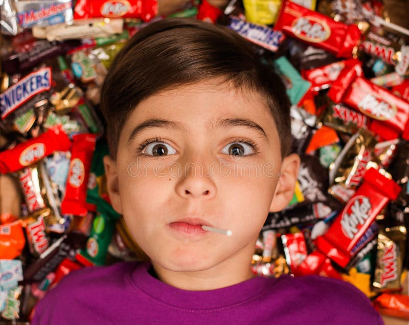 Close-up Image of a Cute Boy Lying on Colorful Candies Editorial Photo ...