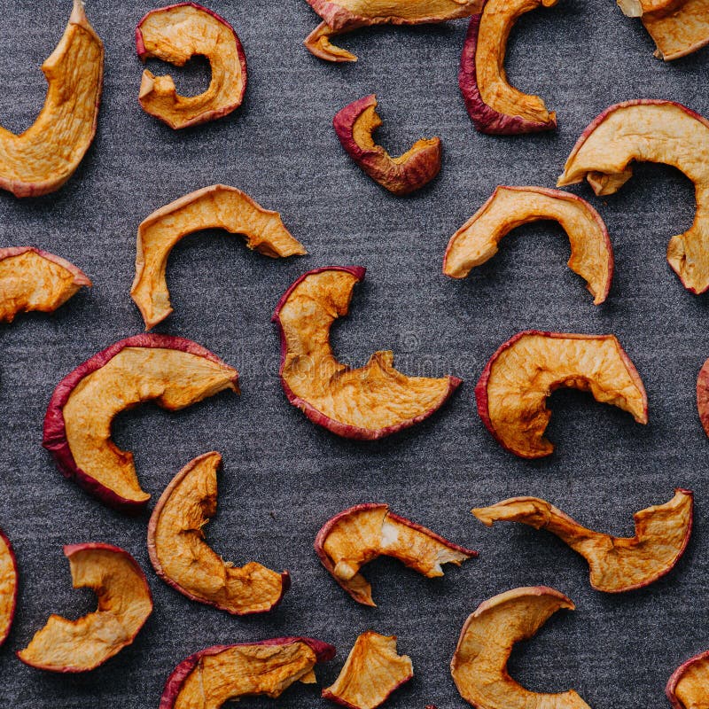 Close Up of Dried Apple Slices on a Grey Textile Surface. Pattern ...