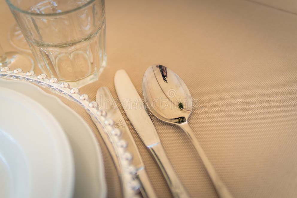 Empty Wedding Reception Hall Table Setting with Silverware and Glass ...