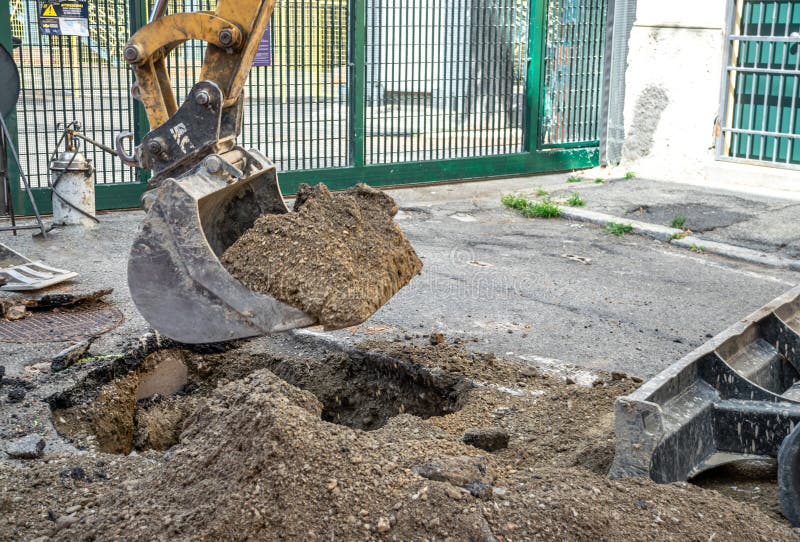 Close Up Image of Excavator in Operation Digging in Ground Stock Photo ...