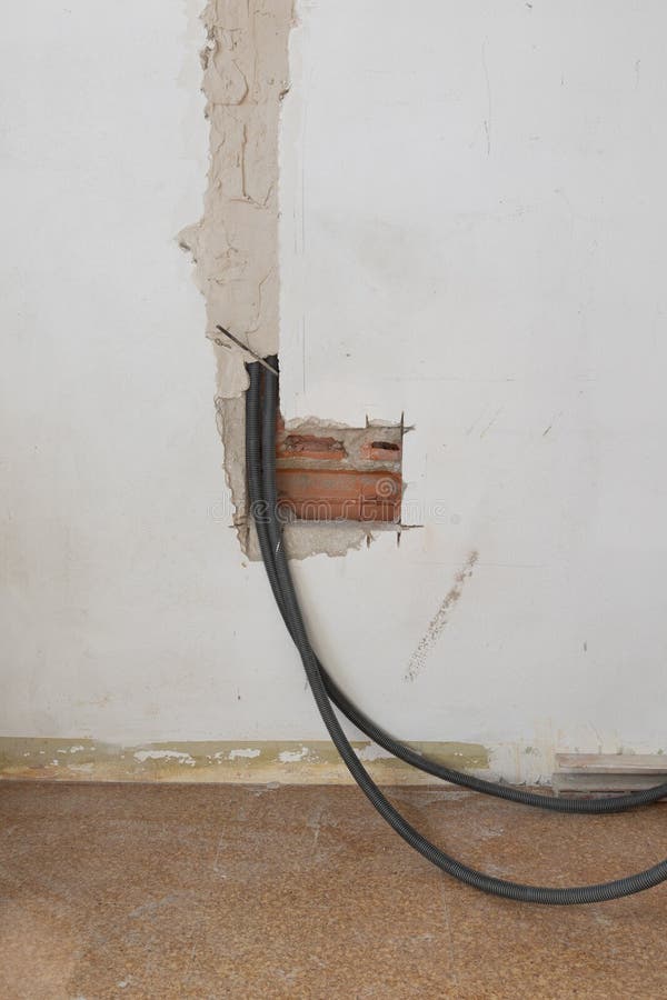 Close-up Image of an Exposed Wall with Electrical Cables during a Home ...