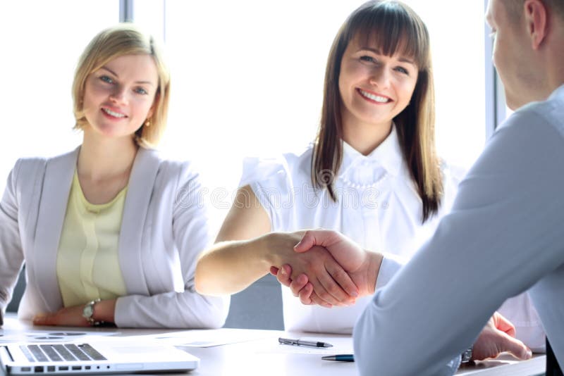 The Close-up Image of a Firm Handshake between Two Colleagues in Office ...