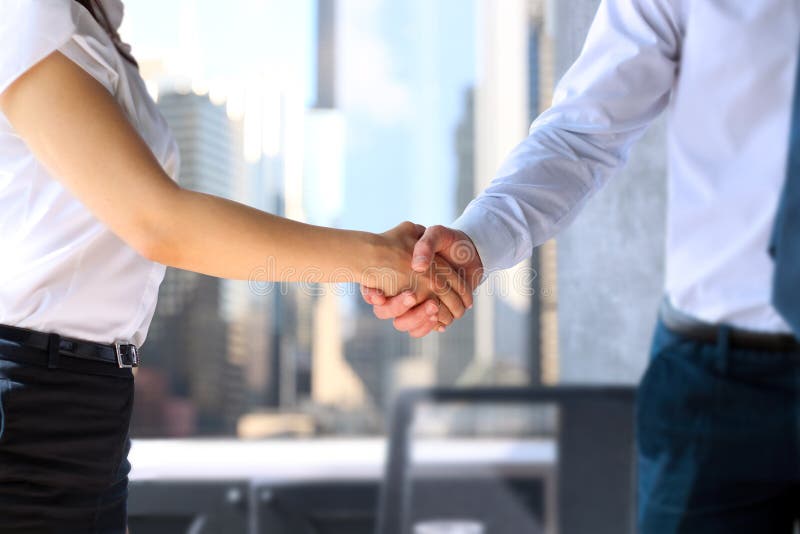 Close-up Image of a Firm Handshake between Two Colleagues after Signing ...