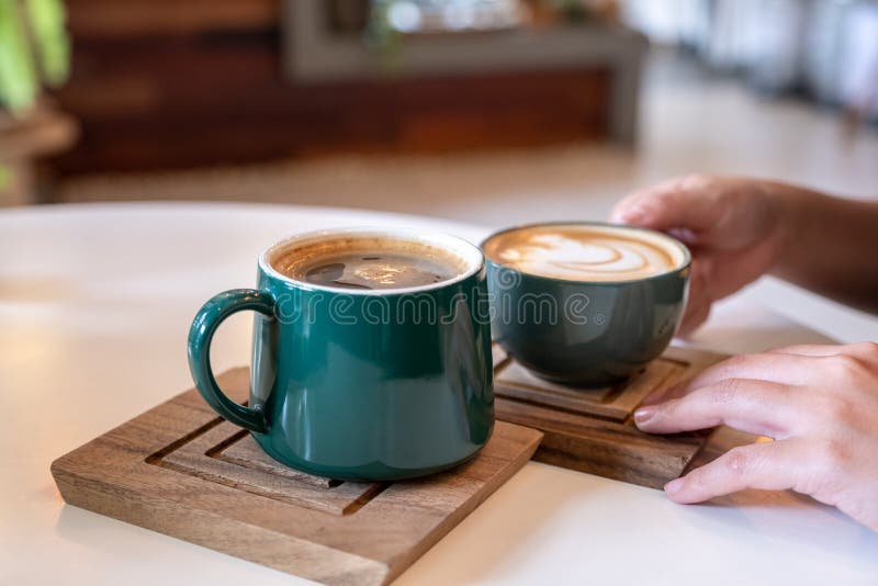 A Hand Holding a Green Coffee Mugs in Cafe Stock Photo - Image of ...