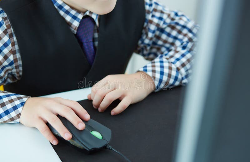 Close-up Image of a Hand of a Little Boy Working at a Computer. Stock ...