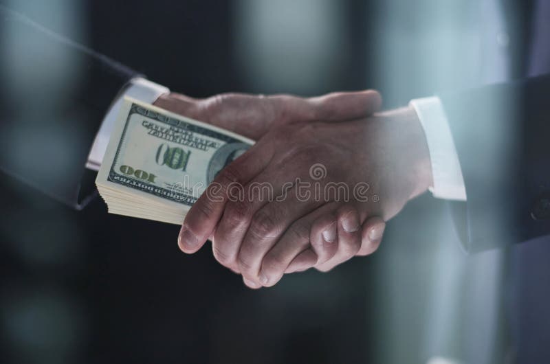 Handshake with the Transfer of Money on a Black Background Stock Image ...