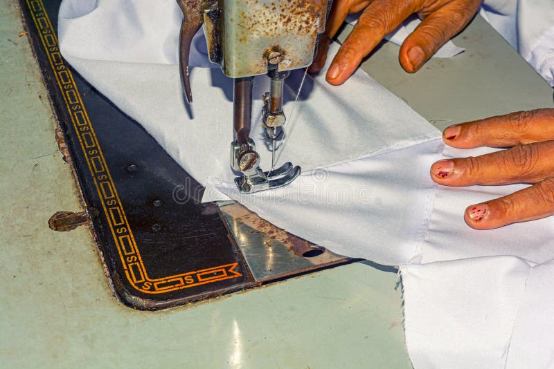 Indian Woman Hands Stitching White Cloth with the Help of a Sewing ...