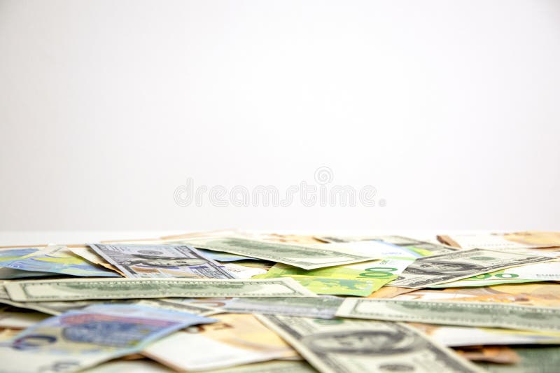 A Close-up Image of a Messy Pile of US Dollar and Euro Banknotes ...