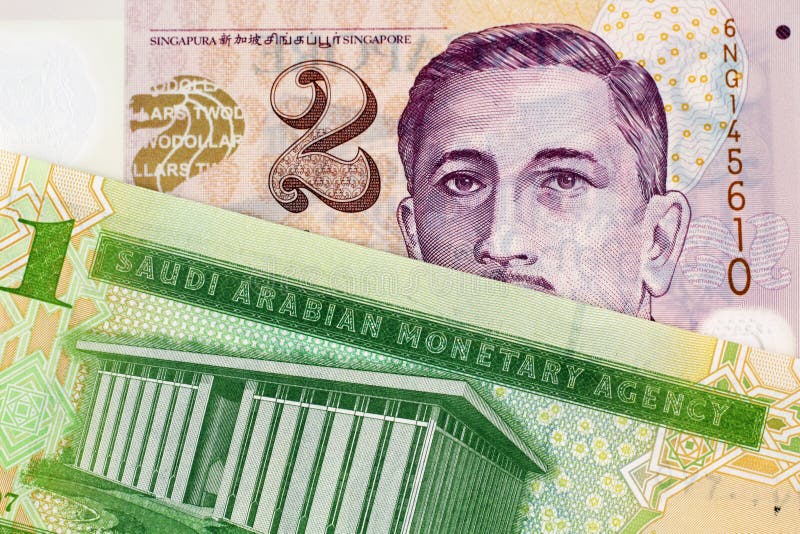 A Two Singapore Dollar Bank Note with a Hundred Chinese Yuan Banknote ...
