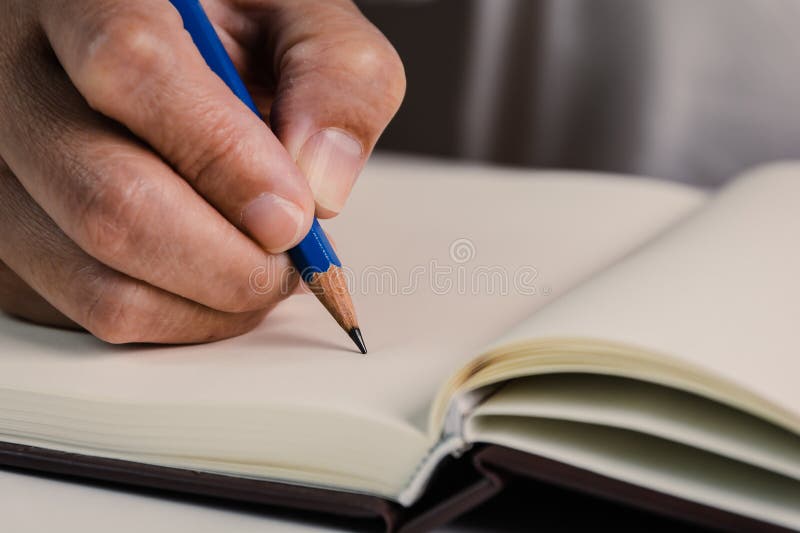 Pencil in People S Hand Start Writing Down Something in the Empty Open ...