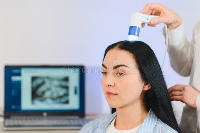 A Close-up Image of a Person Undergoing a Scalp Examination with a ...
