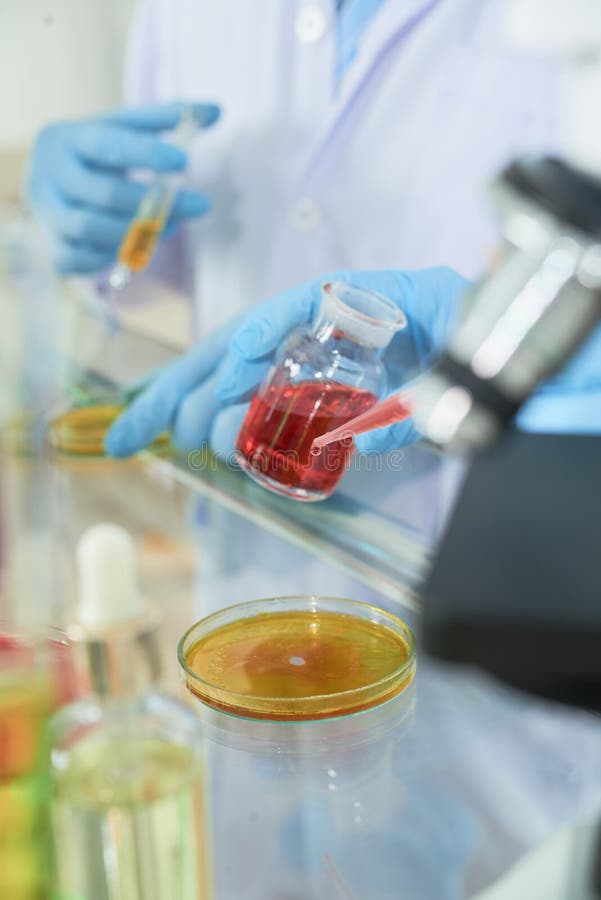Chemist adding reagent stock photo. Image of adding - 120524916