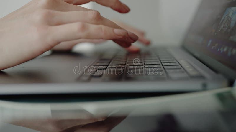 Close-Up of Hands Typing on a Laptop in a Modern Office Setting Stock ...