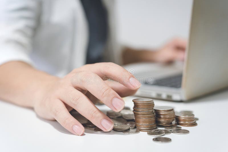 Person Stacks Coins Near Computer, Managing Personal Finance, Saving ...