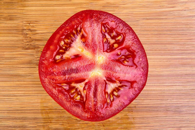 A Close Up Image of a Single Tomato Slice Centered in Frame on Stock ...