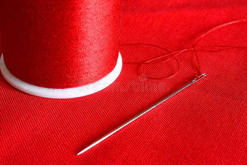 Red Thread and Sewing Needle Stock Photo - Image of satin, luxury ...
