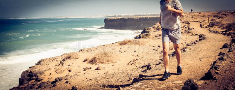 Close Up Image of Sportsman Running Trough Beach. Stock Photo - Image ...