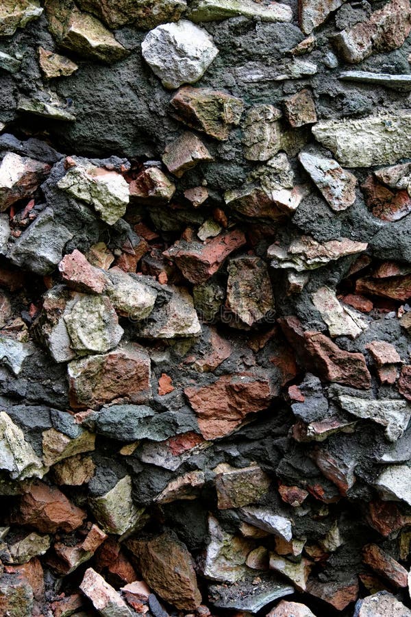 A Close-up Image of a Stone Wall with Different Colored Rocks and ...