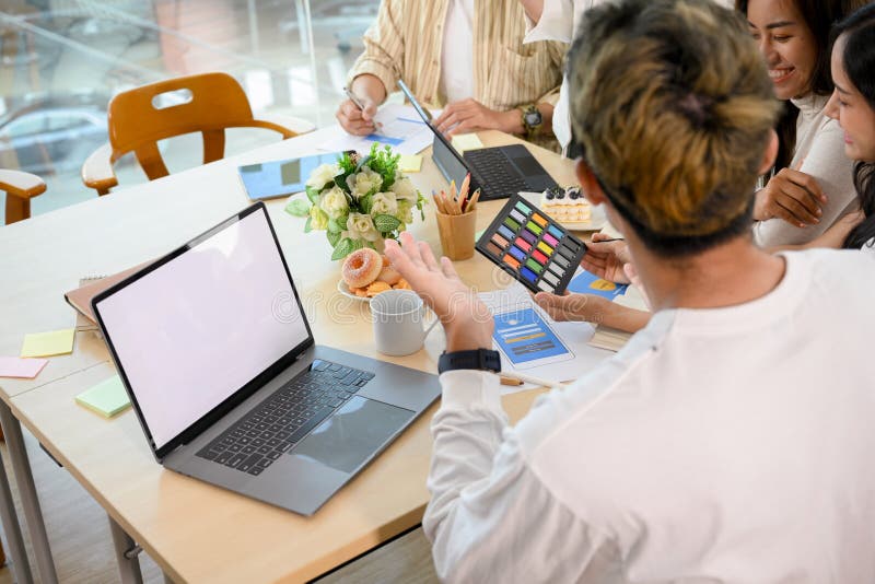 A Team of Graphic Designers and Web Developers are Discussing the ...