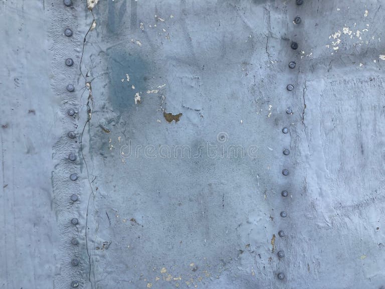 Close-up Image of a Worn, Corroded Metal Structure with Visible Rivets ...