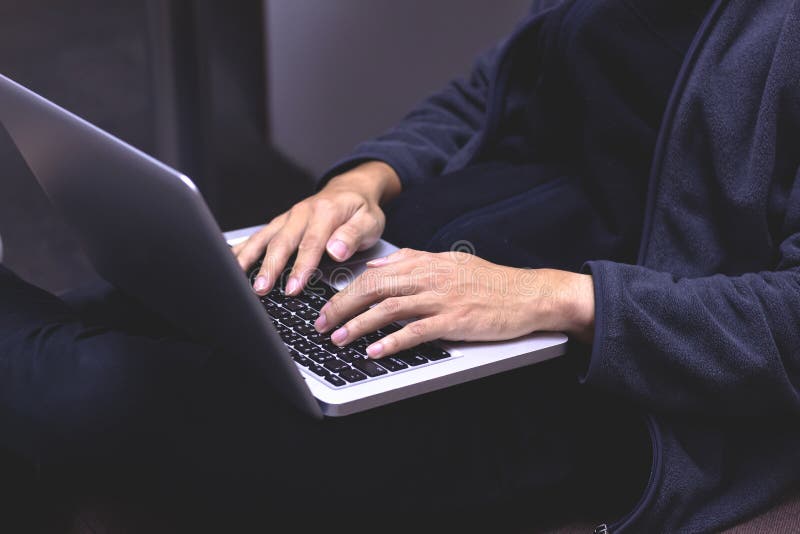 Close-up Image of a Young Man Working on His Laptop at Home. Han Stock ...