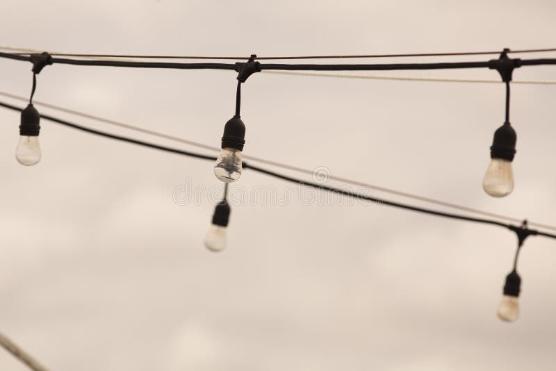 String of Lights with Overcast Background Stock Photo - Image of ...