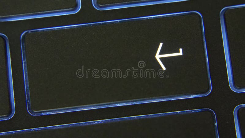 Close-up of Index Finger Pressing Enter Key on Grey Backlit Keyboard ...