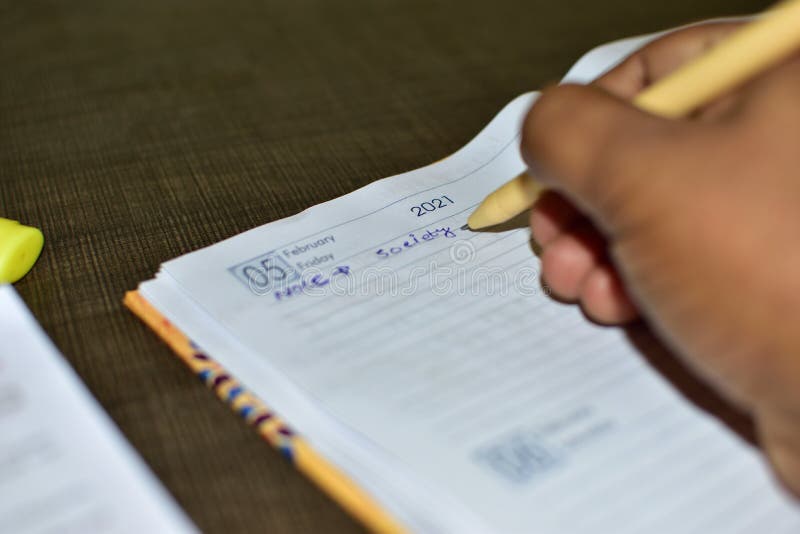 Close Up of an Indian Woman Hand Writing on Notepad. People Learning ...