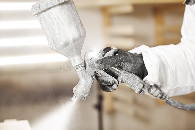 Close-up of Industrial Worker Using Paint Gun or Spray Gun for Applying ...